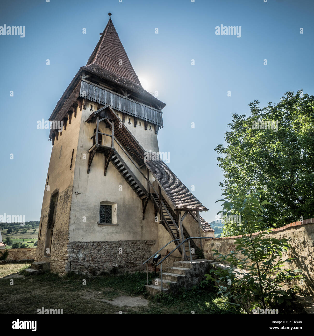 Medieval Biertan village fortified church tower with sun Stock Photo ...