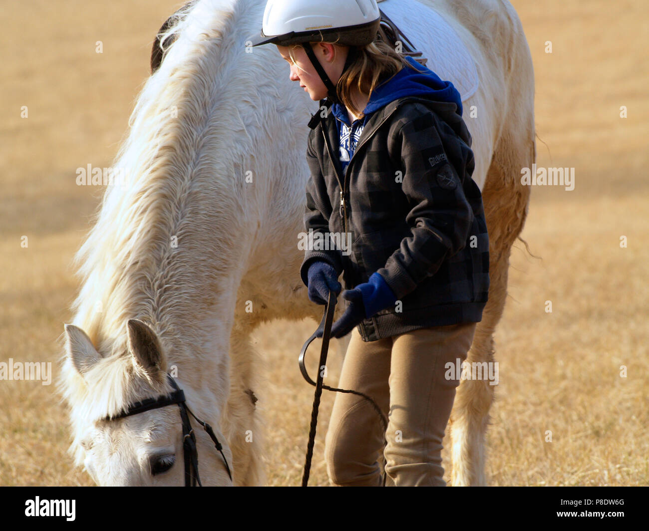 Girl horseback riding Stock Photo - Alamy