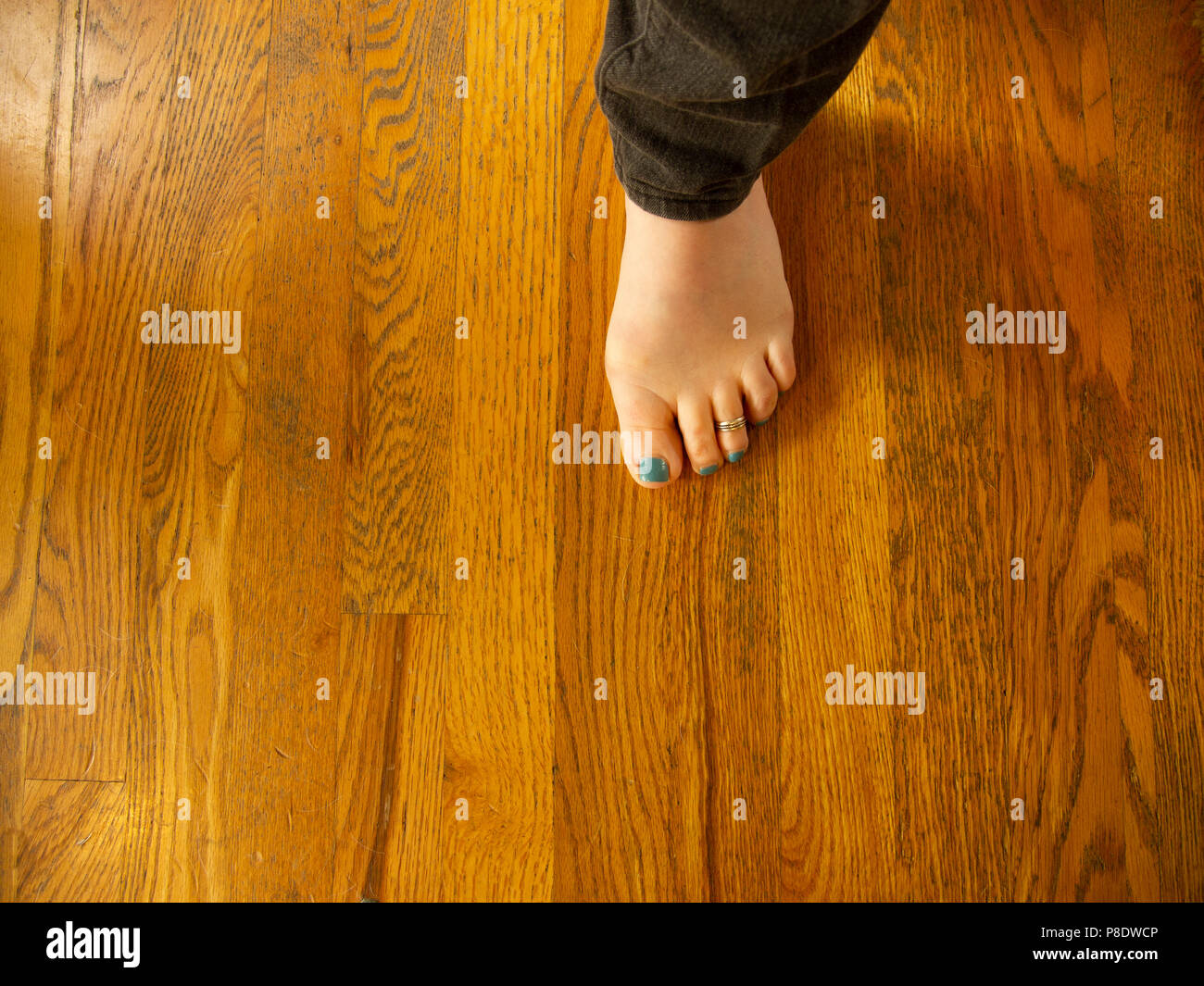 Woman's feet with toe ring Stock Photo - Alamy