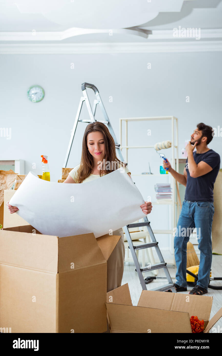Young family unpacking at new house with boxes Stock Photo - Alamy