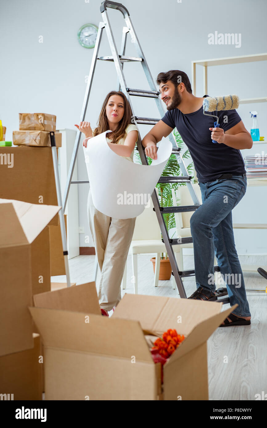 Young family unpacking at new house with boxes Stock Photo - Alamy