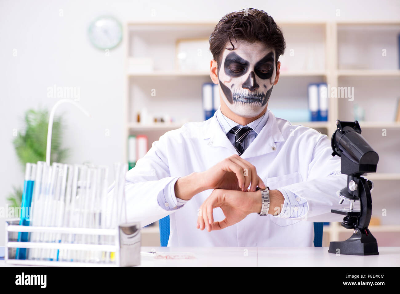 Scary monster doctor working in lab Stock Photo - Alamy