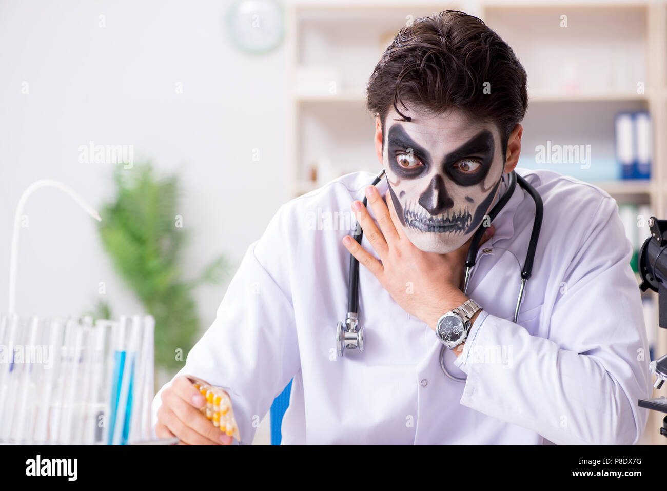 Scary monster doctor working in lab Stock Photo - Alamy