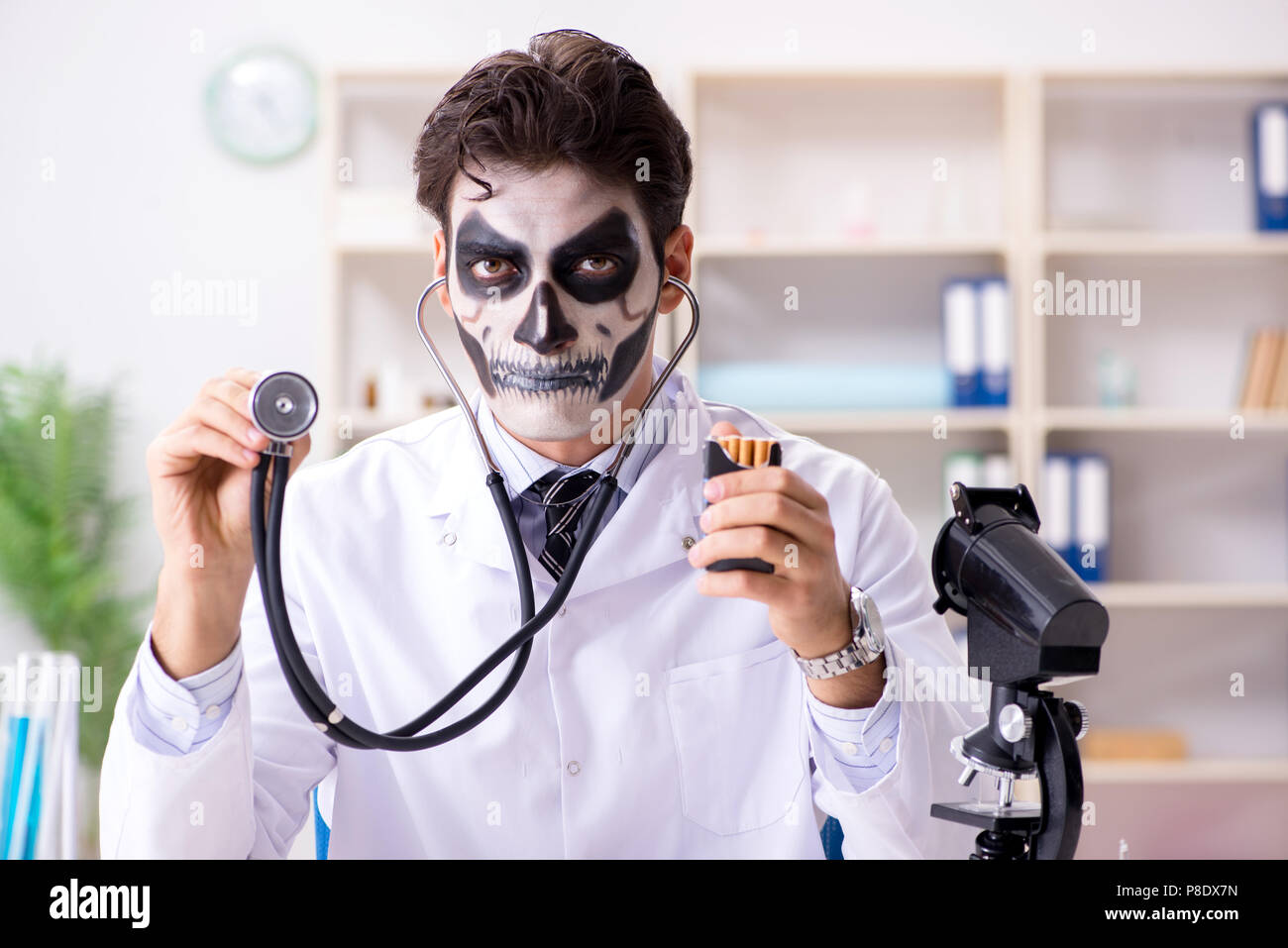 Scary monster doctor working in lab Stock Photo - Alamy