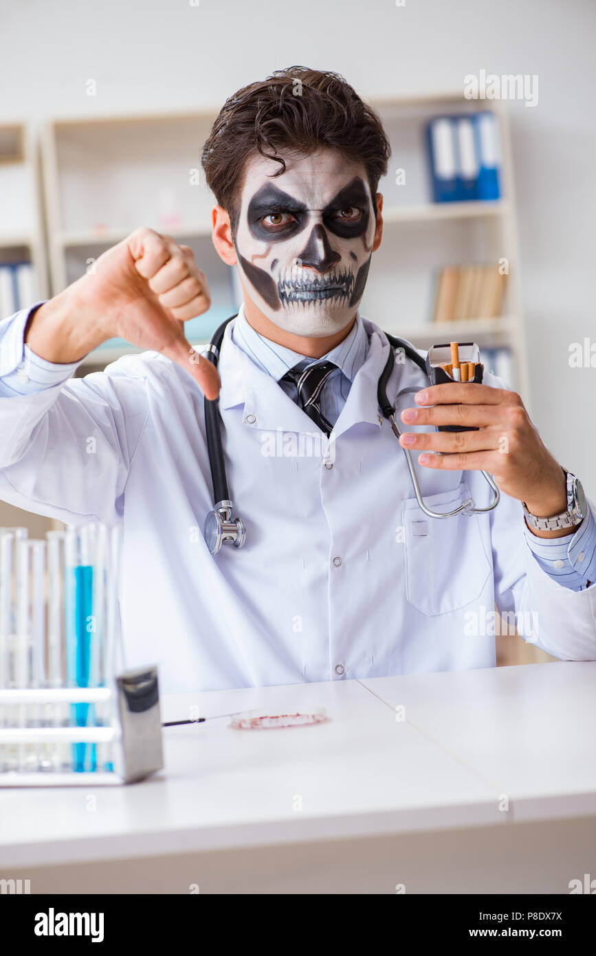 Scary monster doctor working in lab Stock Photo - Alamy