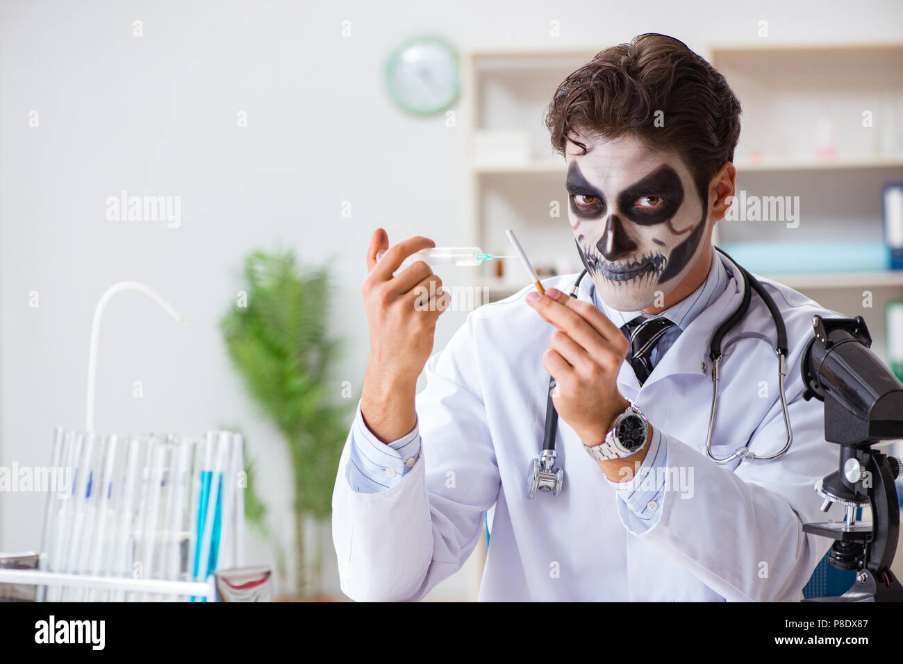 Scary monster doctor working in lab Stock Photo - Alamy