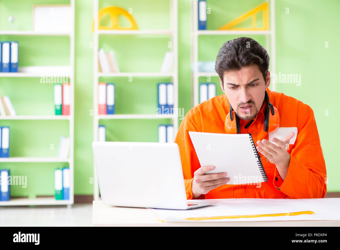 Construction supervisor planning new project in office Stock Photo - Alamy