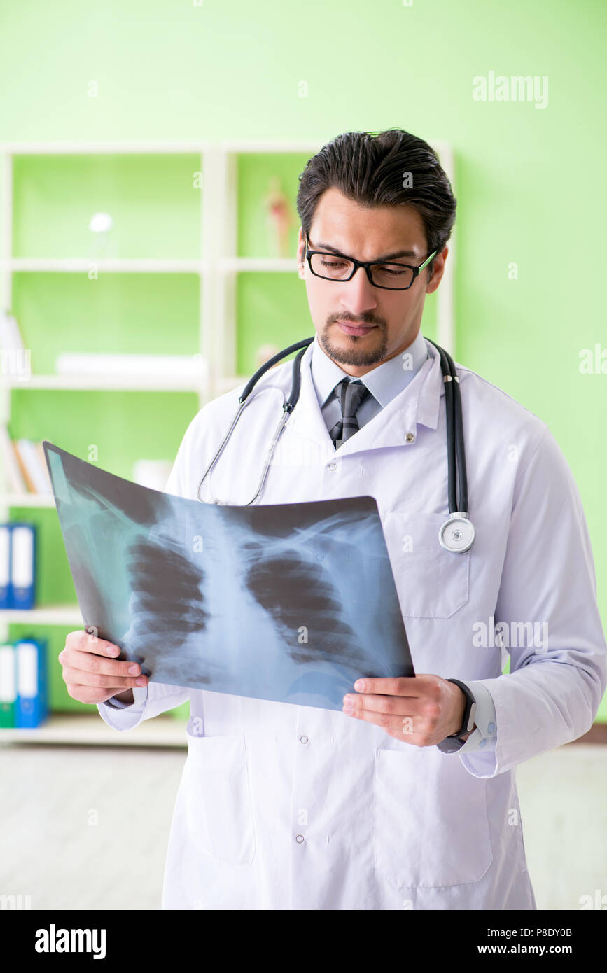 Doctor radiologist looking at x-ray scan in hospital Stock Photo - Alamy
