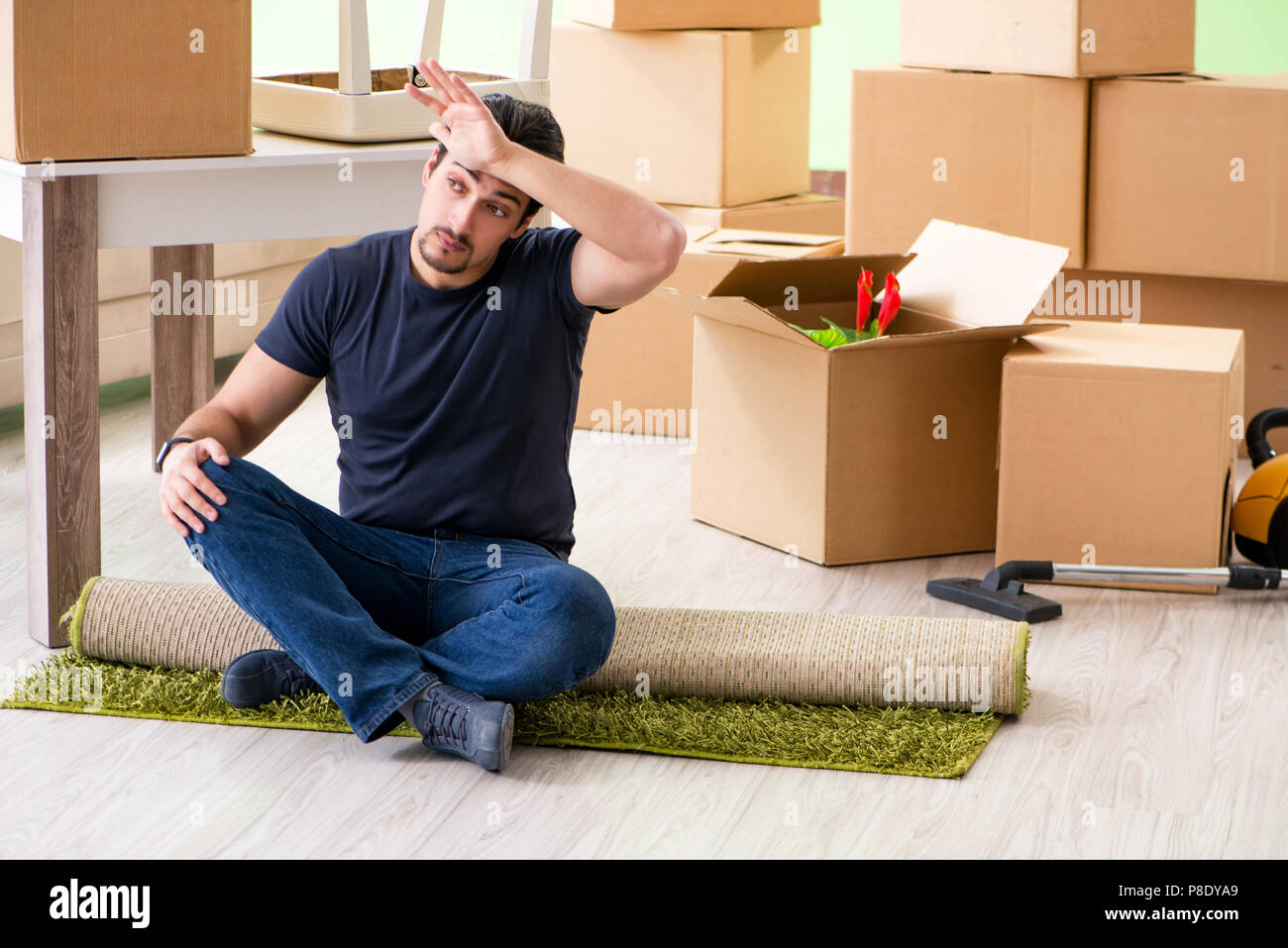Man moving house with boxes Stock Photo - Alamy