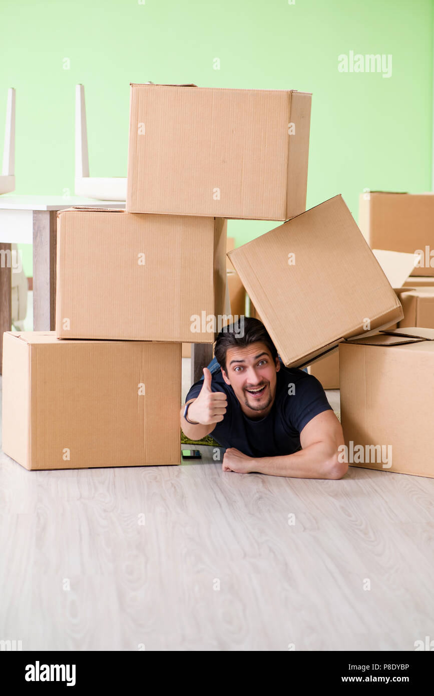 Man moving house with boxes Stock Photo - Alamy