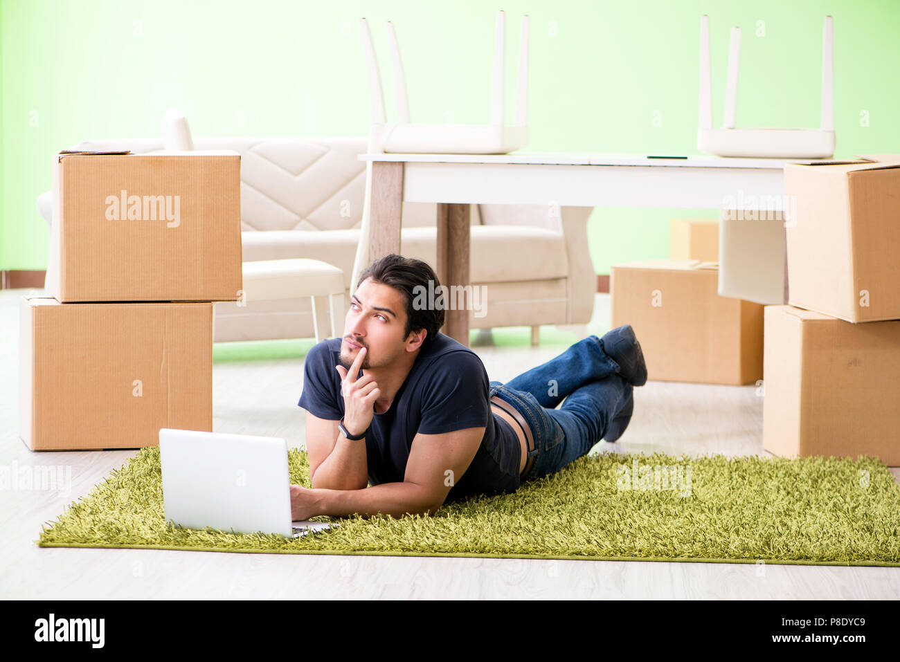 Man moving house with boxes Stock Photo - Alamy