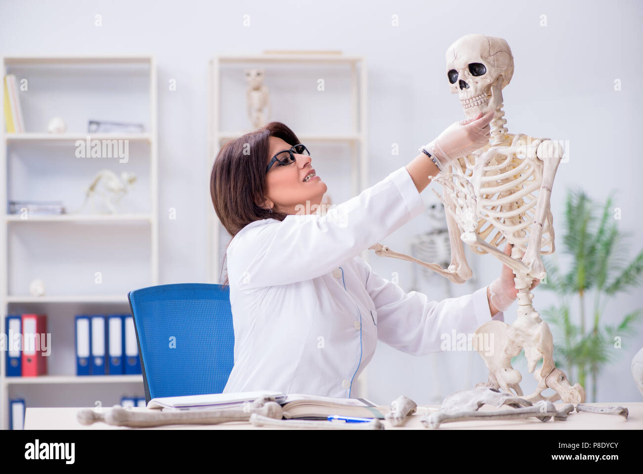 Doctor working in the lab on skeleton Stock Photo - Alamy