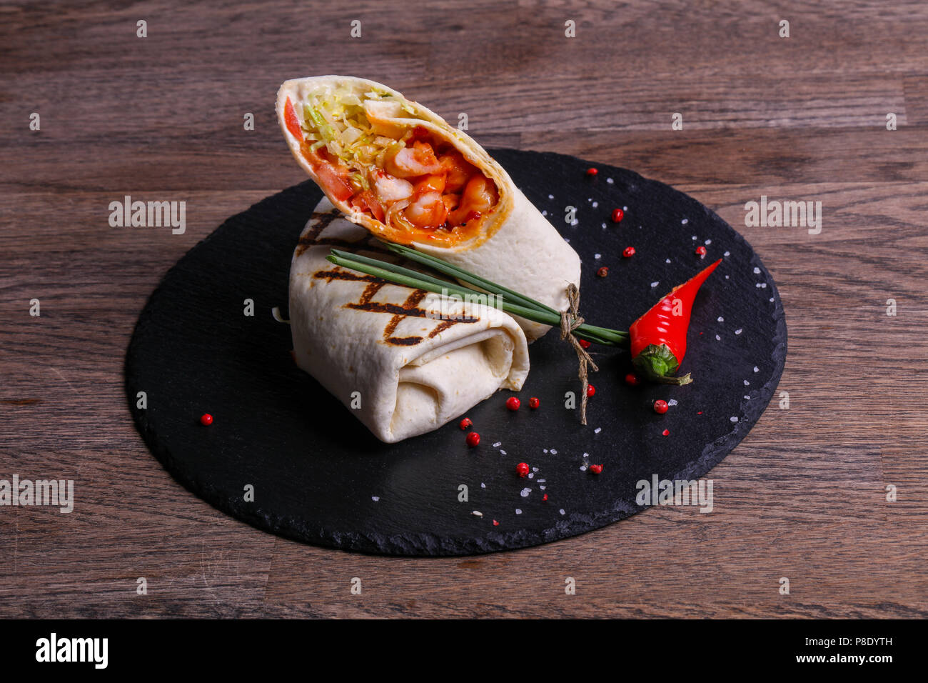 Chicken roll with tortilla served pepper Stock Photo - Alamy