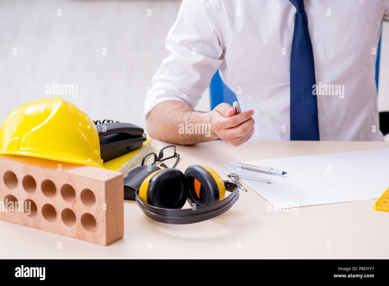Architect working in his studio on new project Stock Photo - Alamy