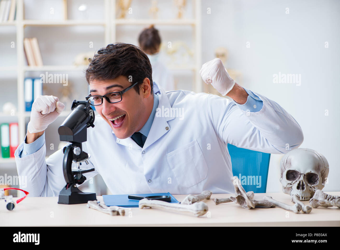Professor studying human skeleton in lab Stock Photo - Alamy