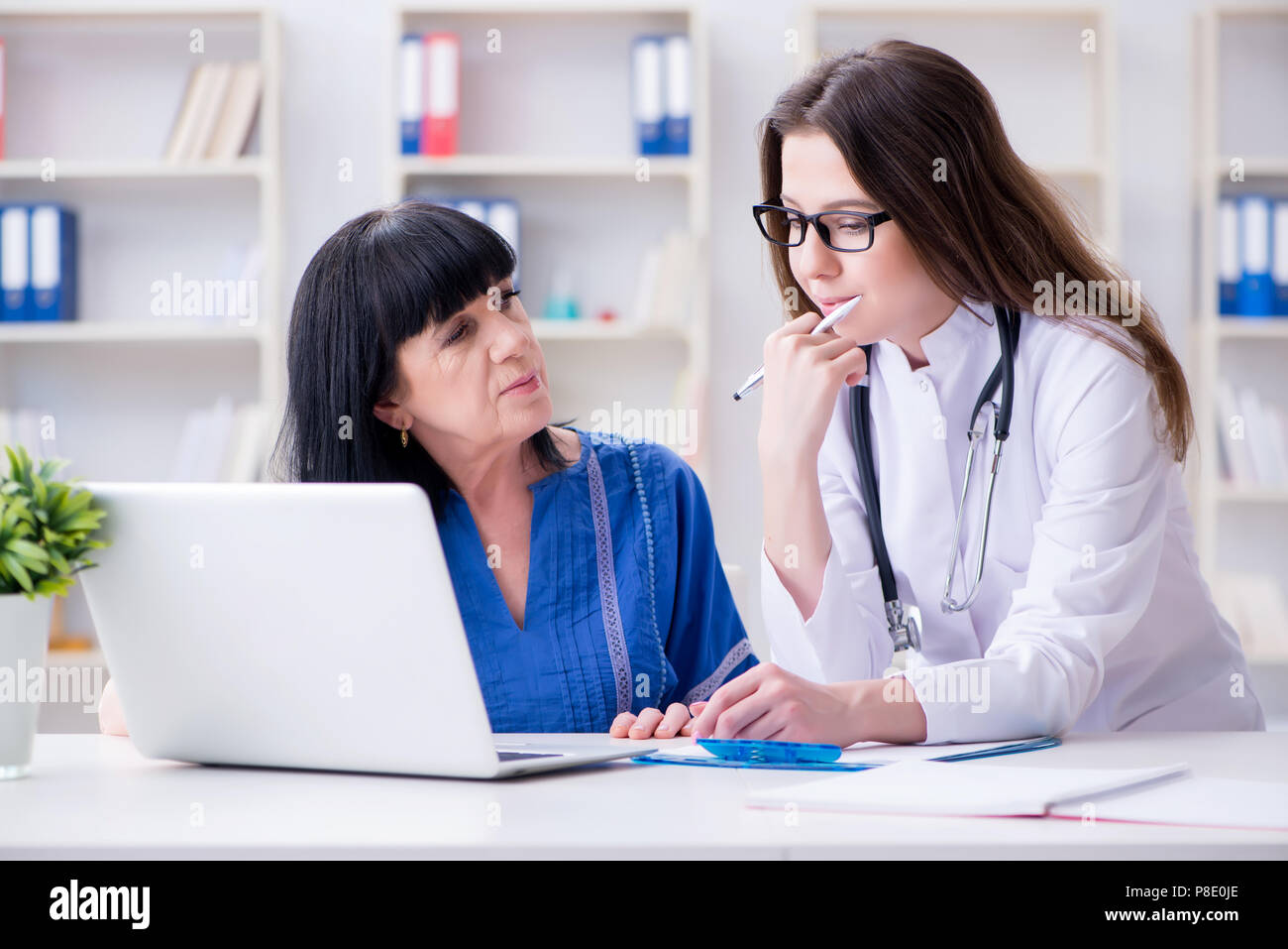 Senior patient visiting doctor for regular check-up Stock Photo - Alamy
