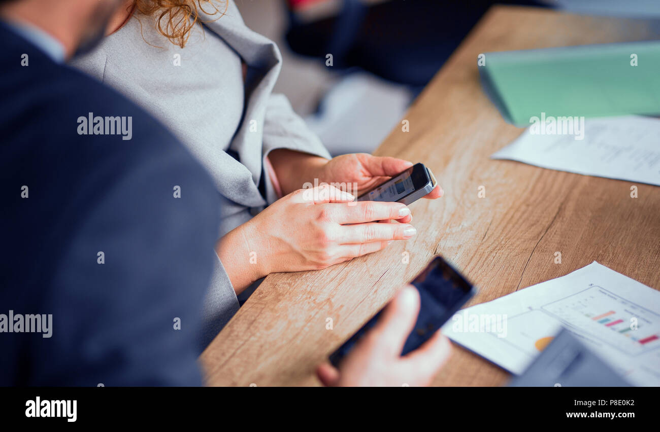 Business team meeting at modern work space. Close up view of man and ...