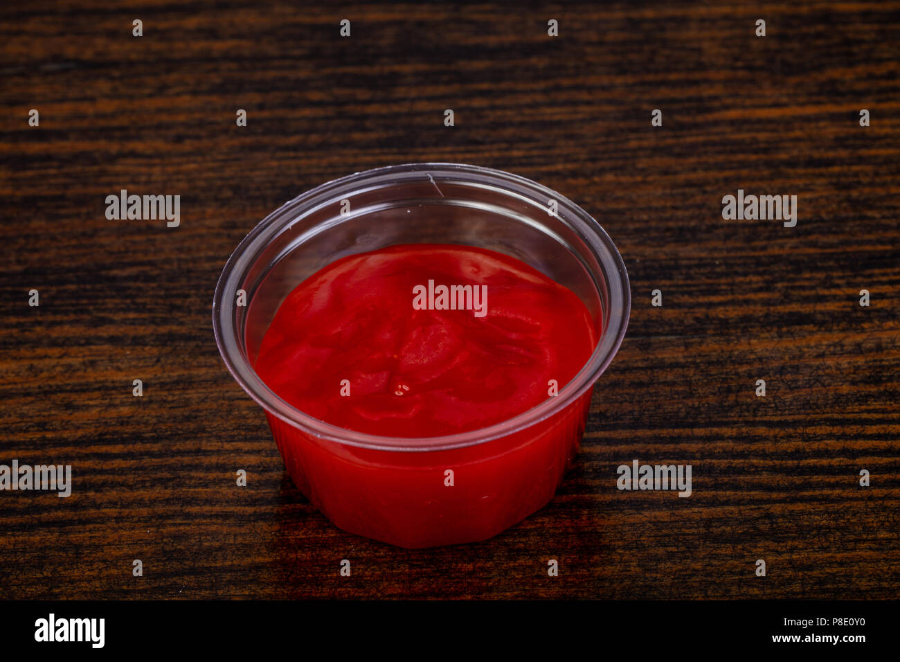Ketchup sauce portion over wooden Stock Photo - Alamy