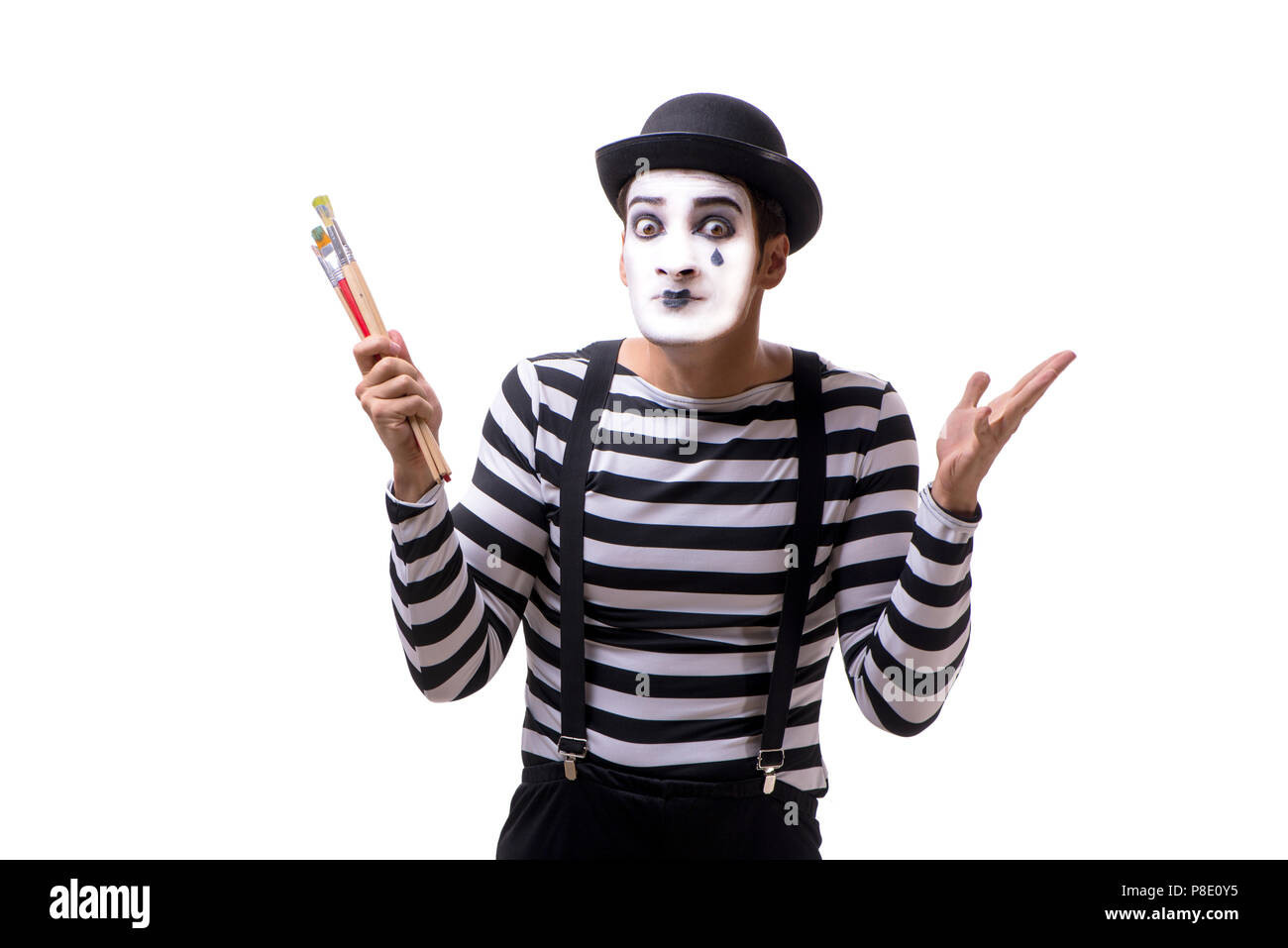 Mime holding brushes isolated on white background Stock Photo - Alamy