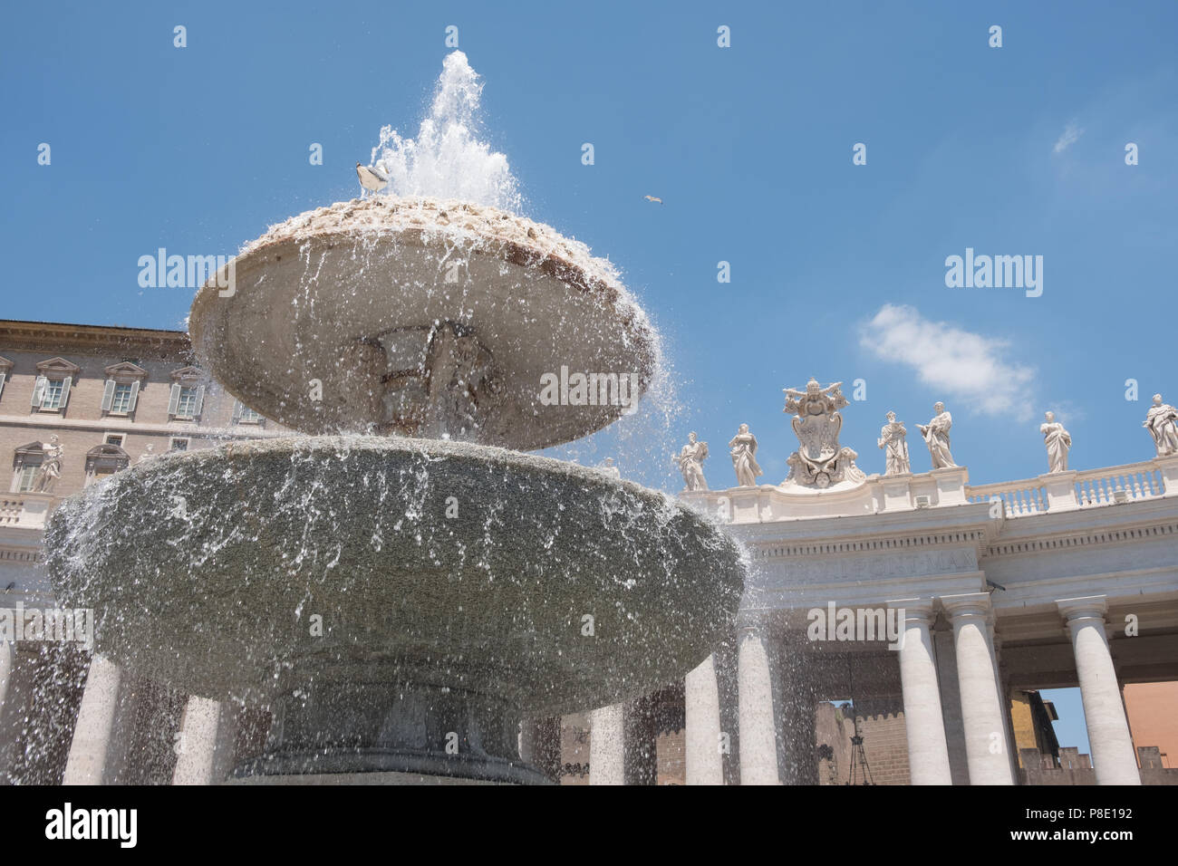 Fountain in Rome with the background of St. Peter's Basilica Stock ...