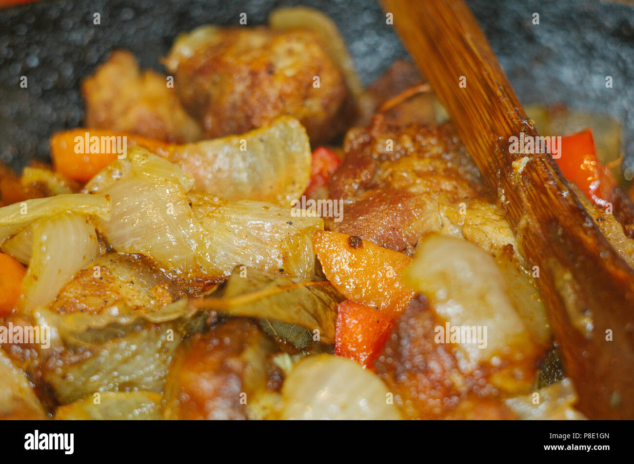 Roast meat, onions, carrots and spices, boiling in oil, homemade ...