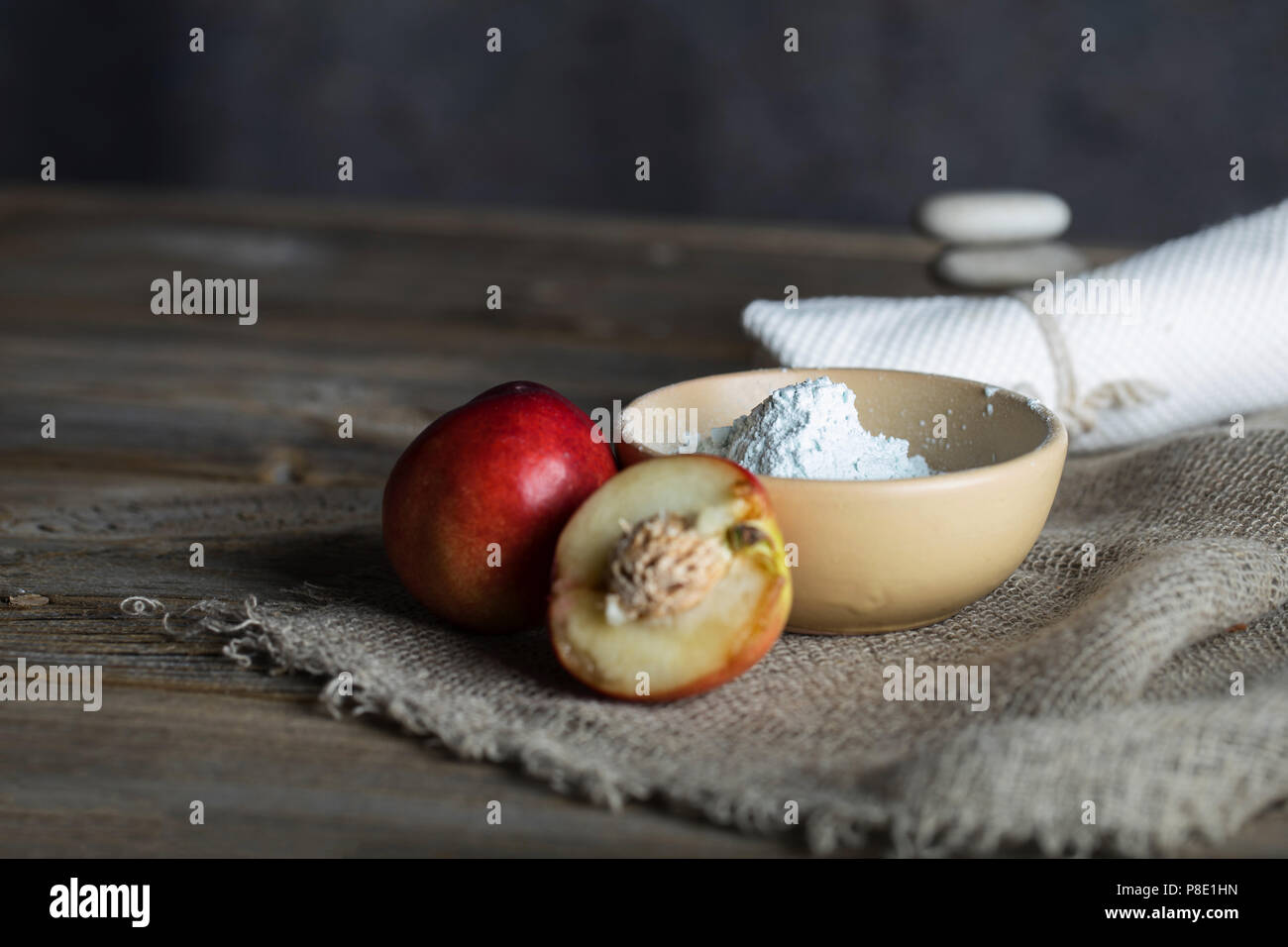 Peach seeds facial mask in a clay pot. Closeup Stock Photo - Alamy