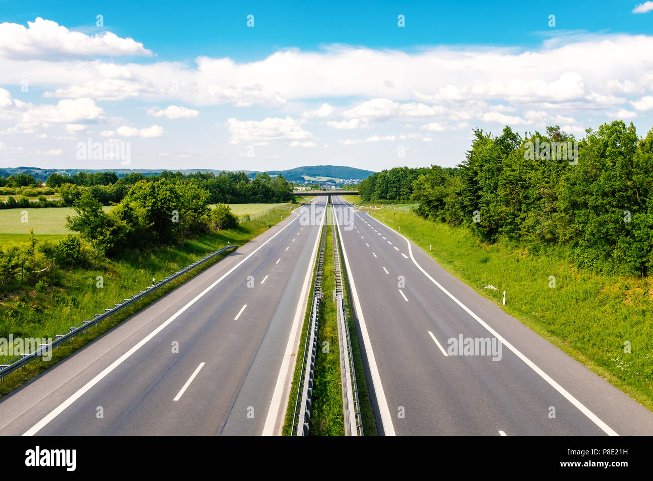 Empty motorway with blue sky above hi-res stock photography and images ...