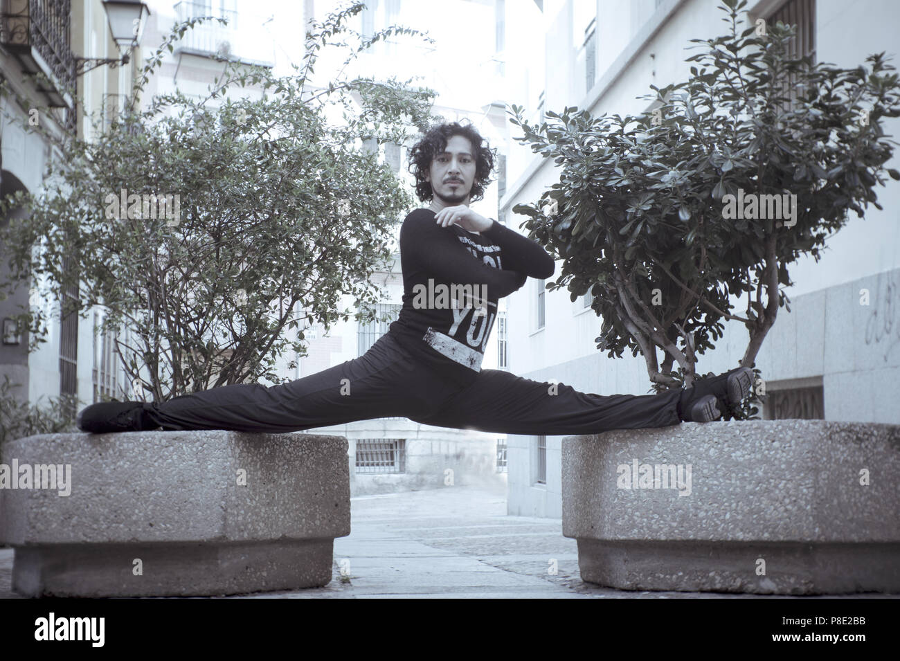 Male dancer in ballet pose. Street background Stock Photo - Alamy