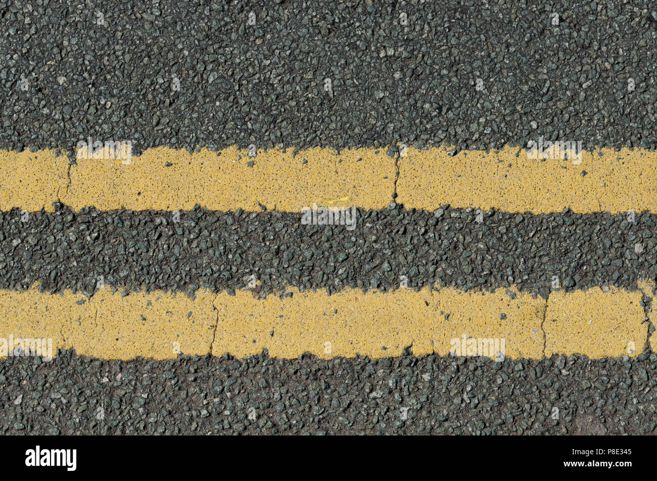 Close detailed view of a road surface constructed from stone chippings ...