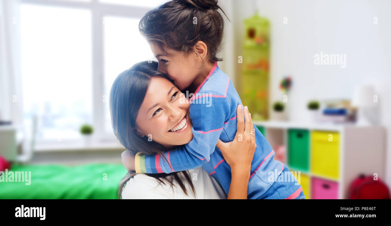 happy mother and daughter hugging and kissing Stock Photo - Alamy