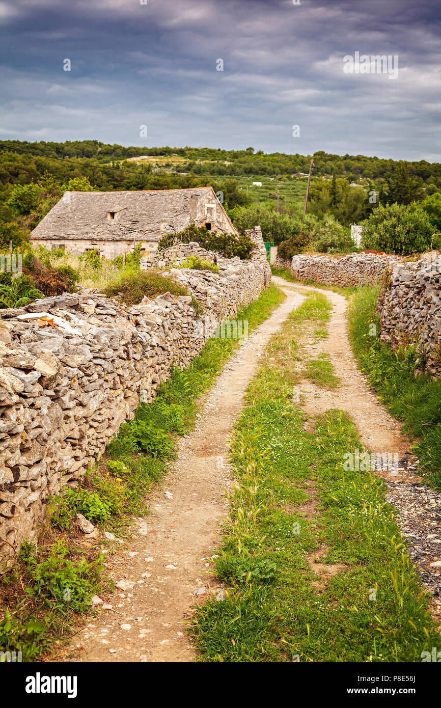 Gravel path to old stone house. Island of Brac, Croatia Stock Photo - Alamy
