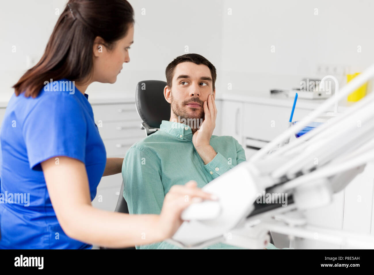 patient with toothache at dentist office Stock Photo - Alamy
