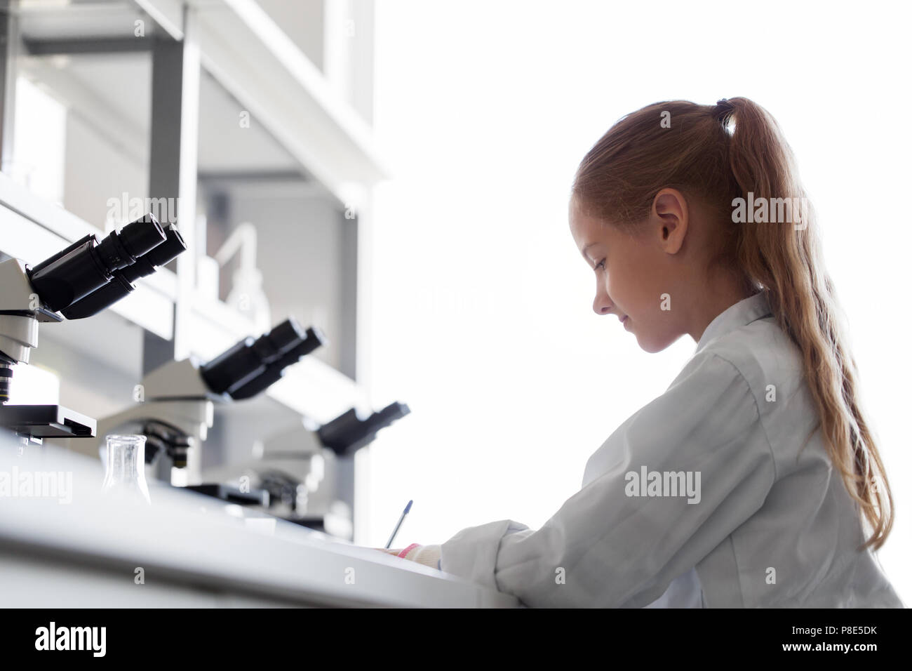 girl studying chemistry at school laboratory Stock Photo - Alamy