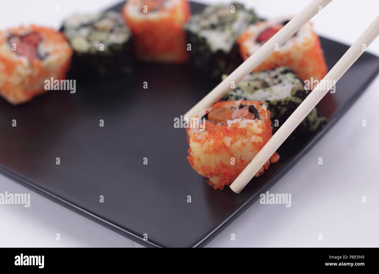 closeup.sticks and a set of Sushi rolls Stock Photo - Alamy