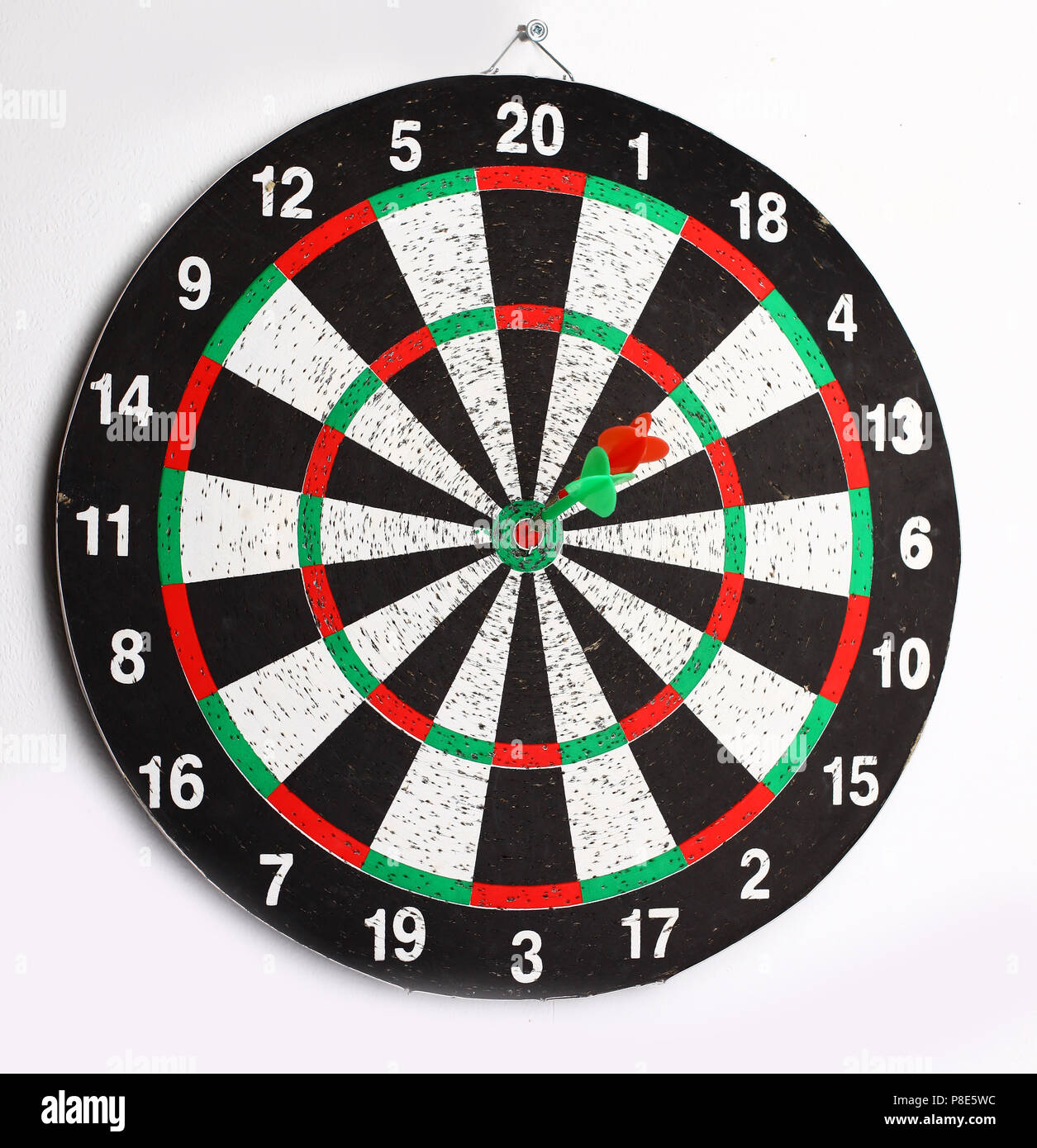 side view.Arrow dart hitting the center of the target dart Board Stock ...