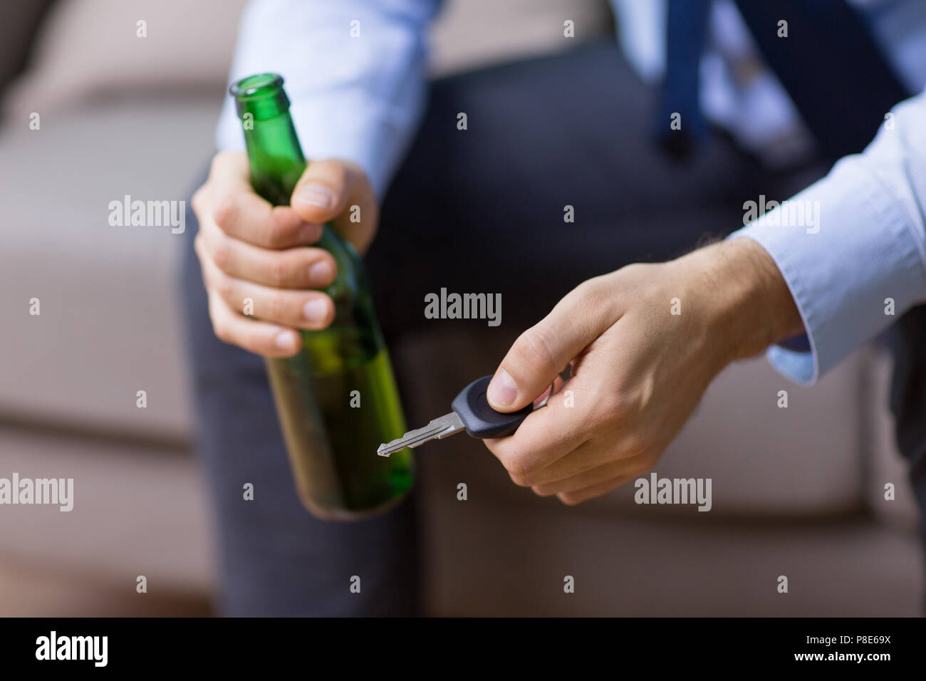 Hand holding beer bottle driving hi-res stock photography and images ...