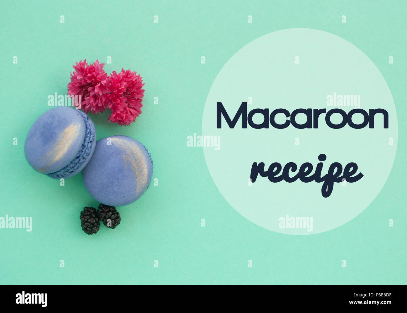 Two violet color macaroons with golden strokes and beautiful flowers on ...