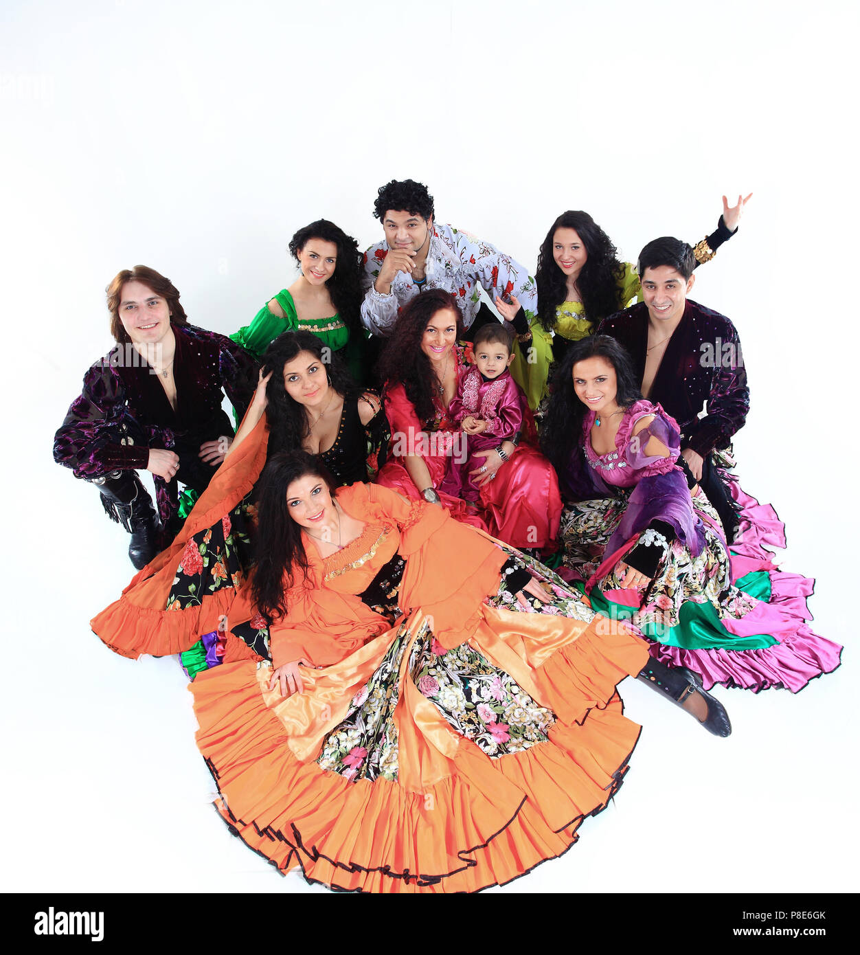 portrait of a Gypsy dance group with a little boy dancer in traditional ...