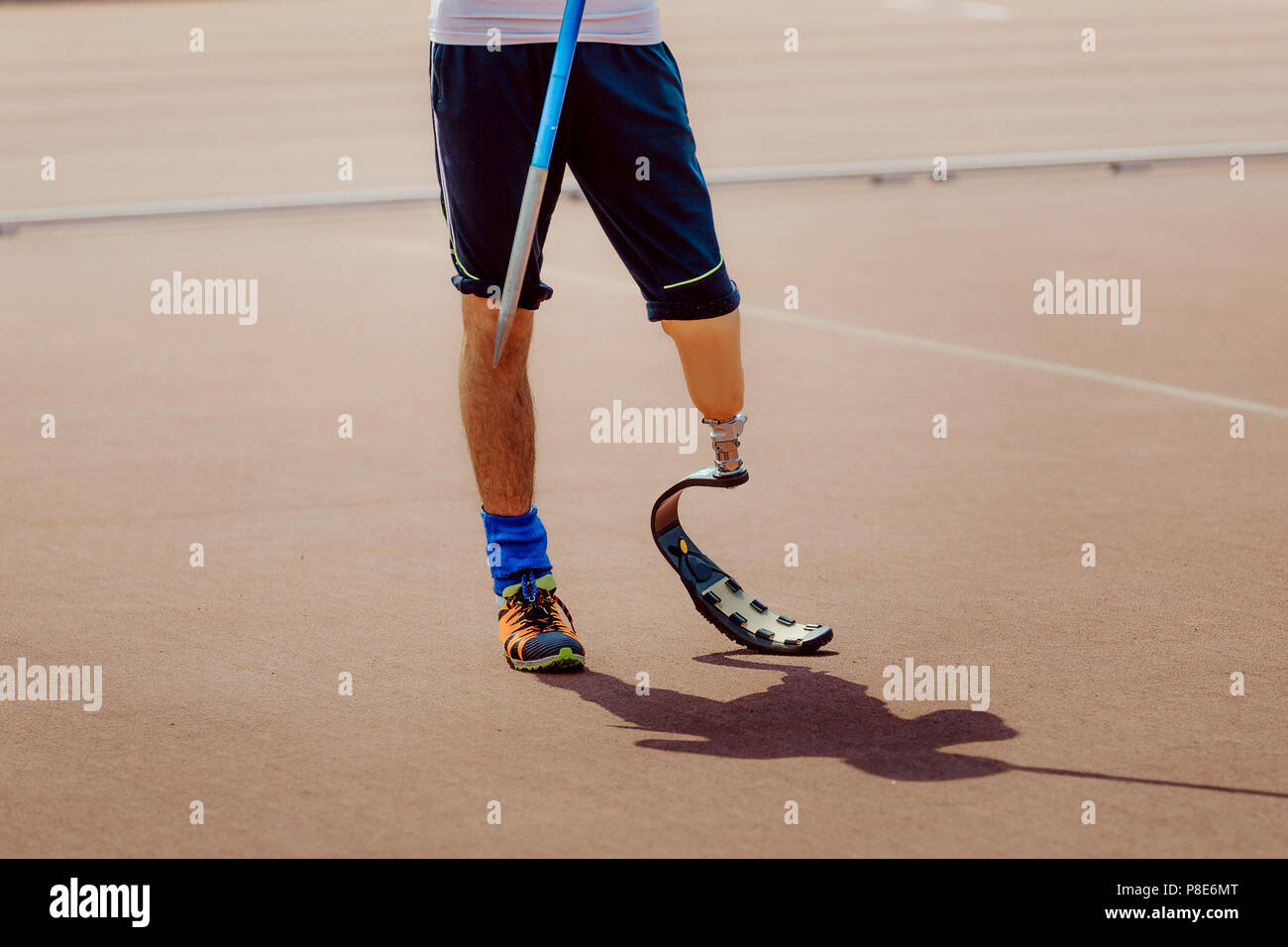 man disabled athlete on prosthesis leg javelin throw in stadium Stock ...
