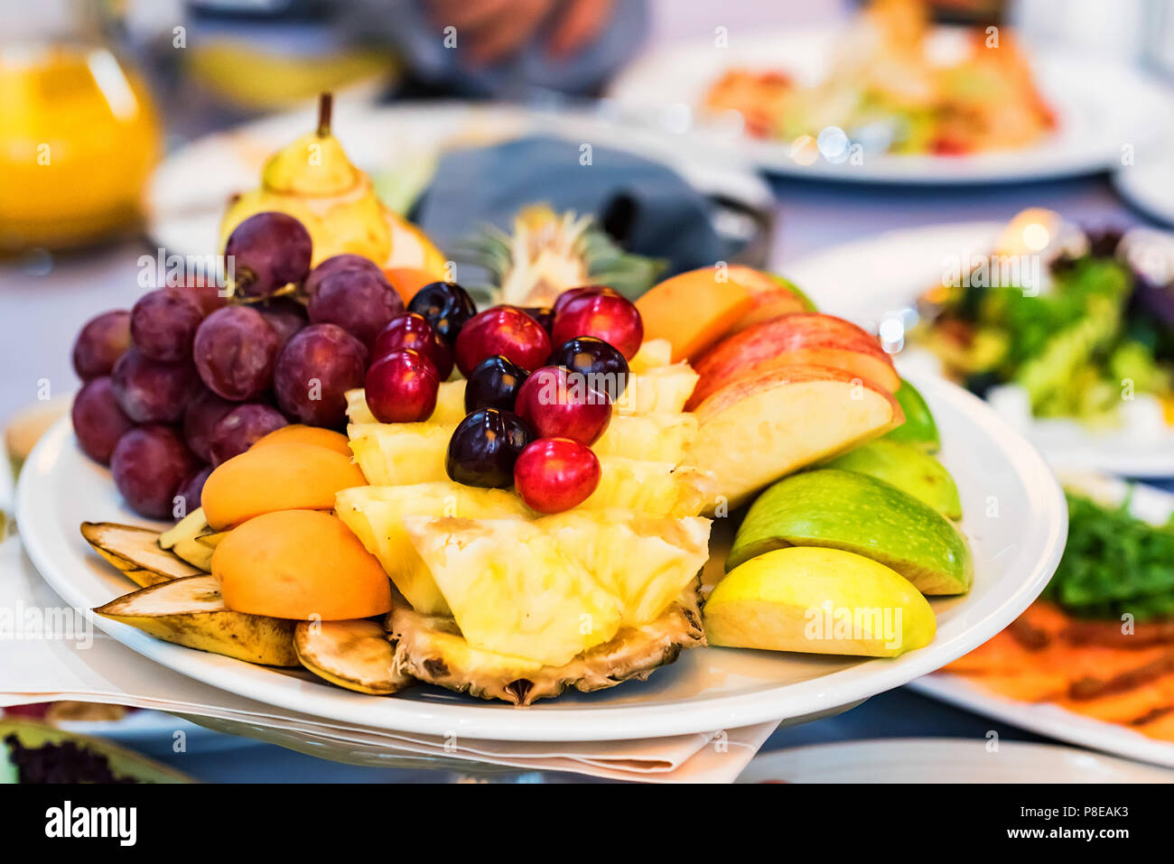 Beautiful fruit plate on festive table Stock Photo - Alamy
