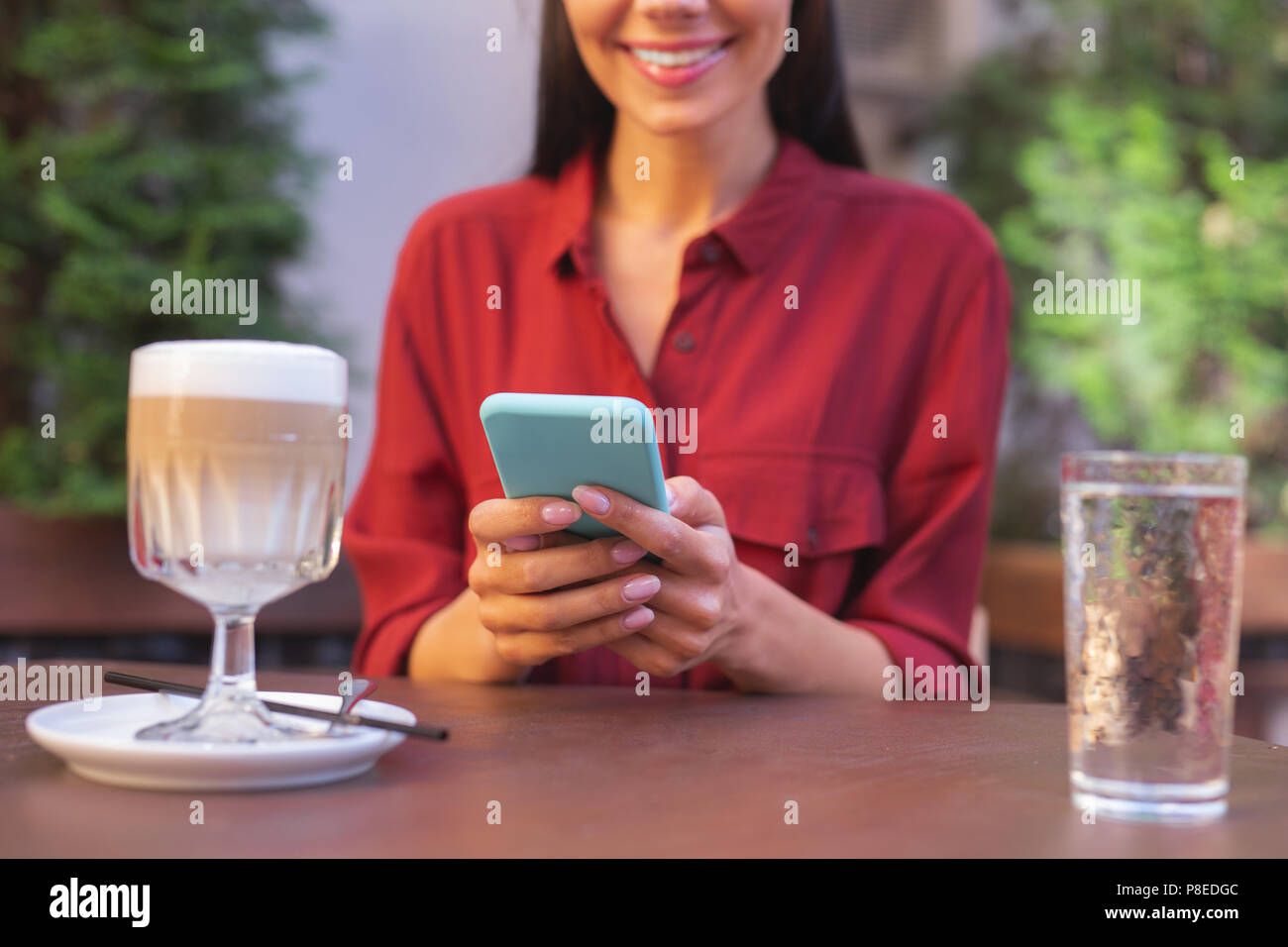 Beaming woman having coffee break with her friends Stock Photo - Alamy