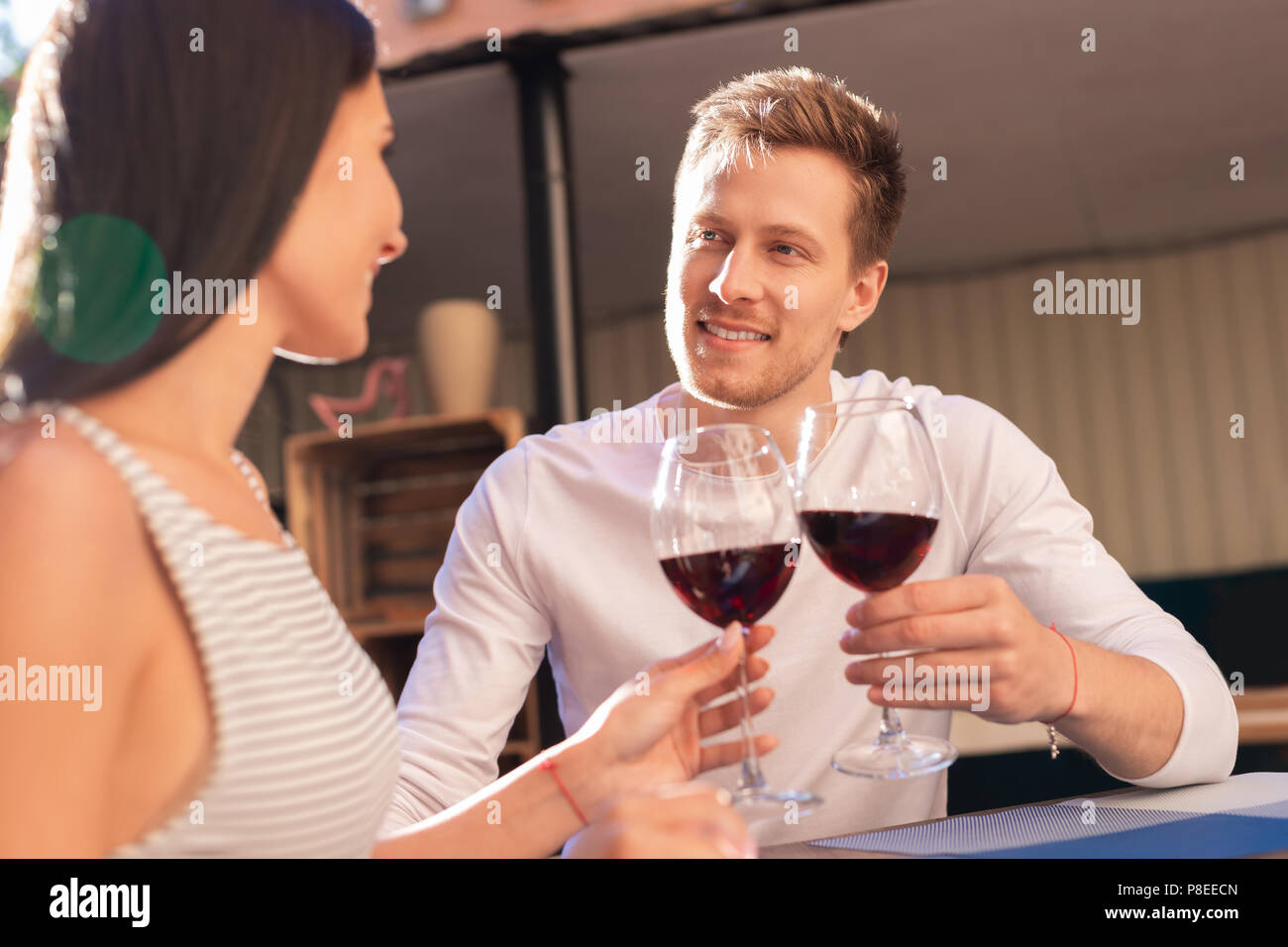 Blue-eyed handsome man giving compliments to her woman Stock Photo - Alamy