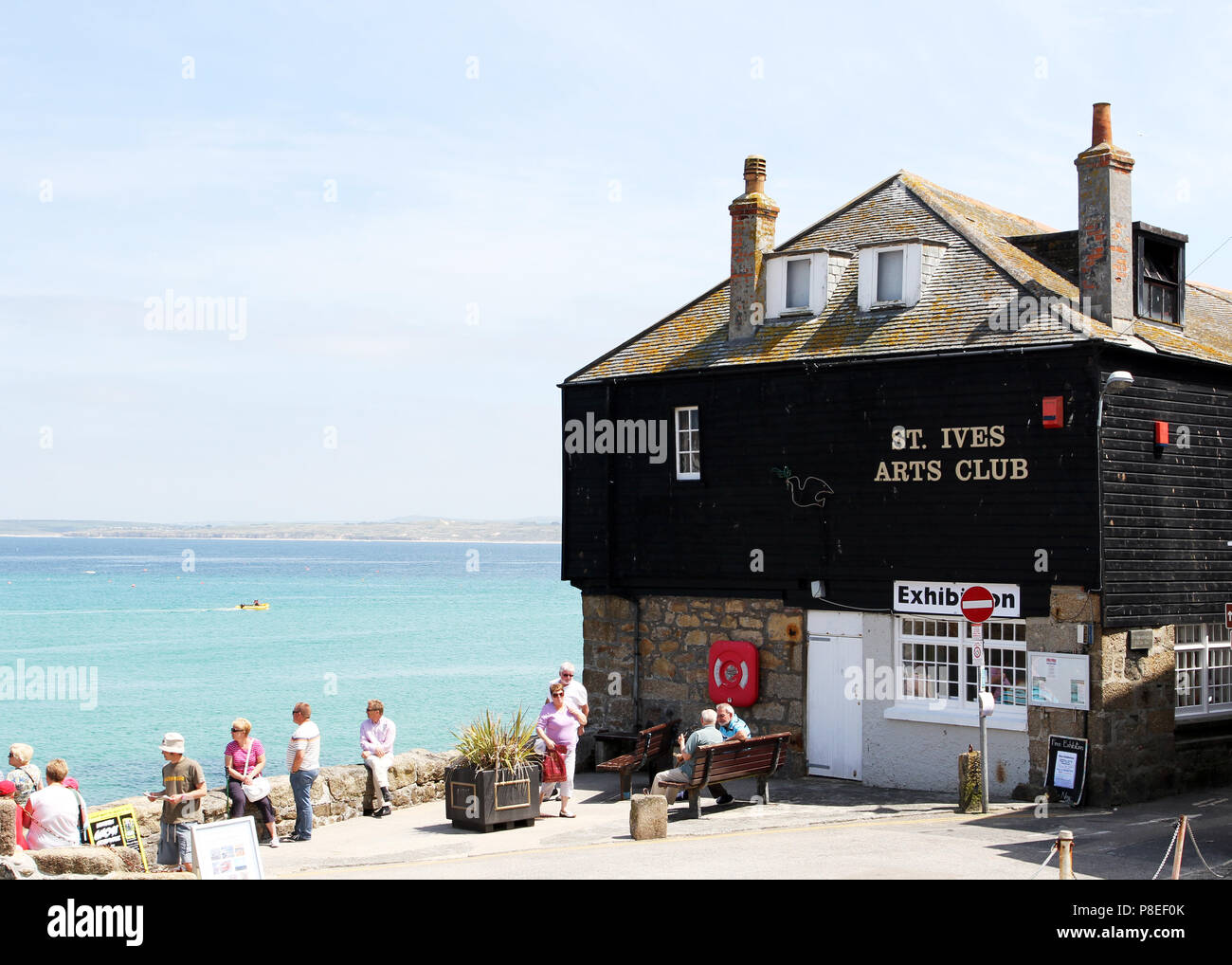 Seaside Village of St. Ives. View of St. Ives arts club with tourists ...