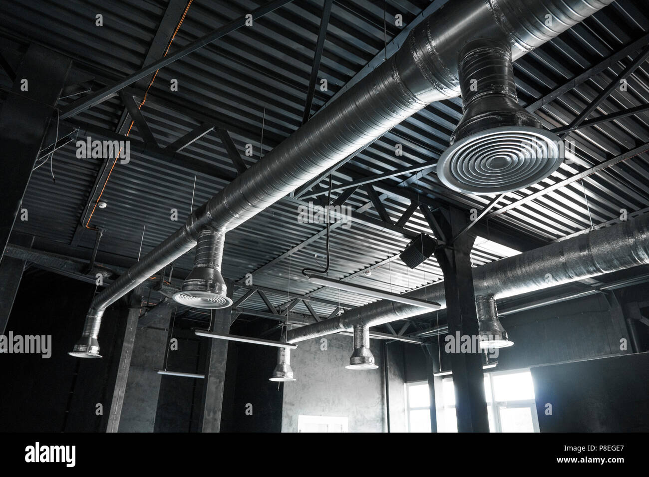 Ventilation system on the ceiling of large buildings. Ventilation pipes ...