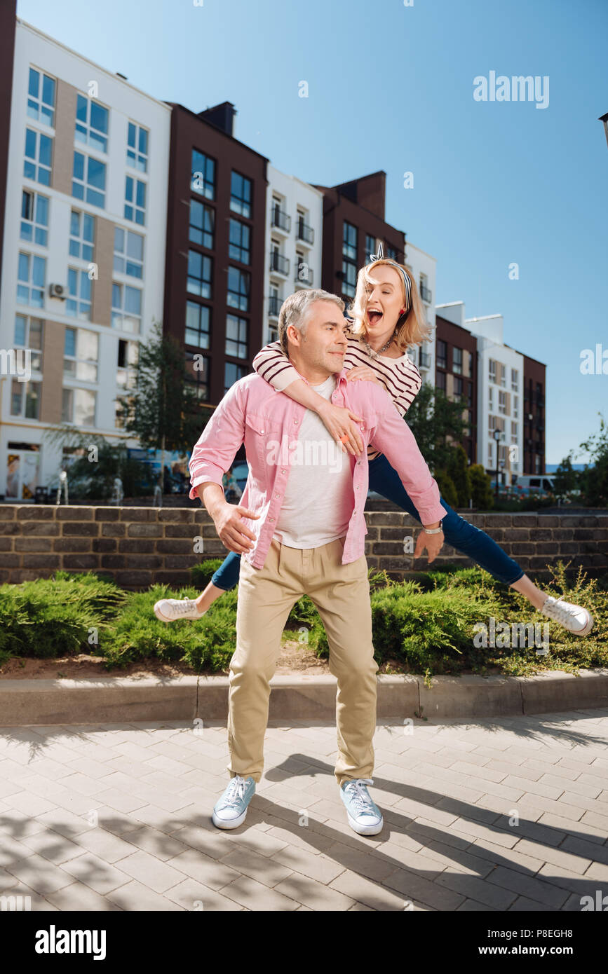 Happy delighted woman expressing her emotions Stock Photo - Alamy