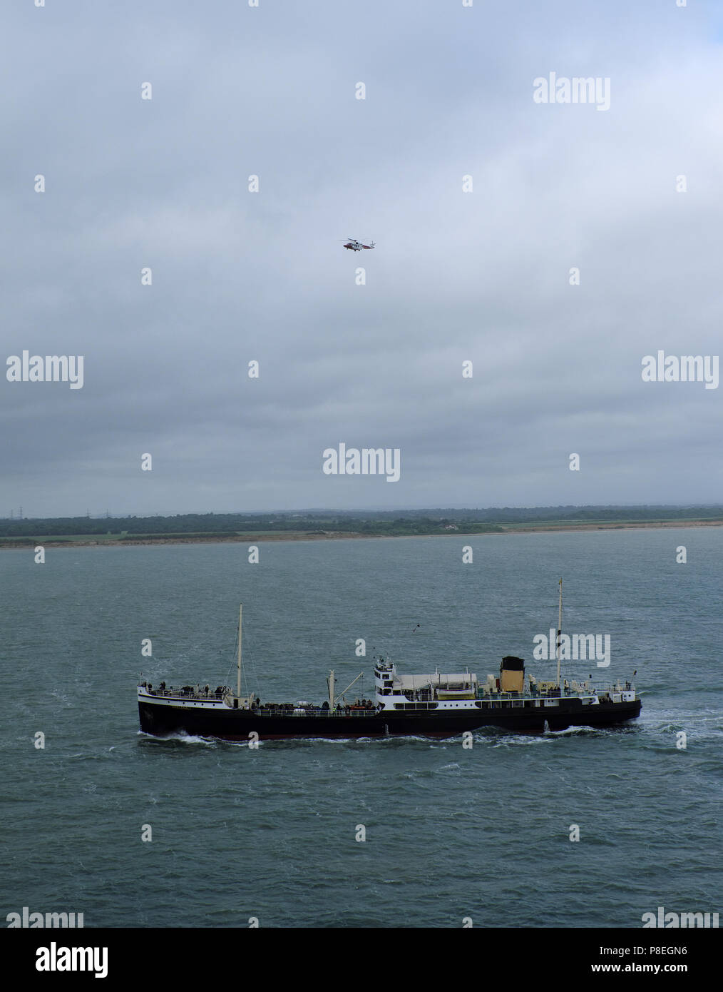 Helicopter over ship in Southampton harbour Stock Photo - Alamy