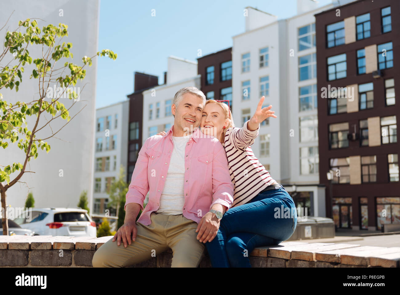 Woman outside pointing at house hi-res stock photography and images - Alamy