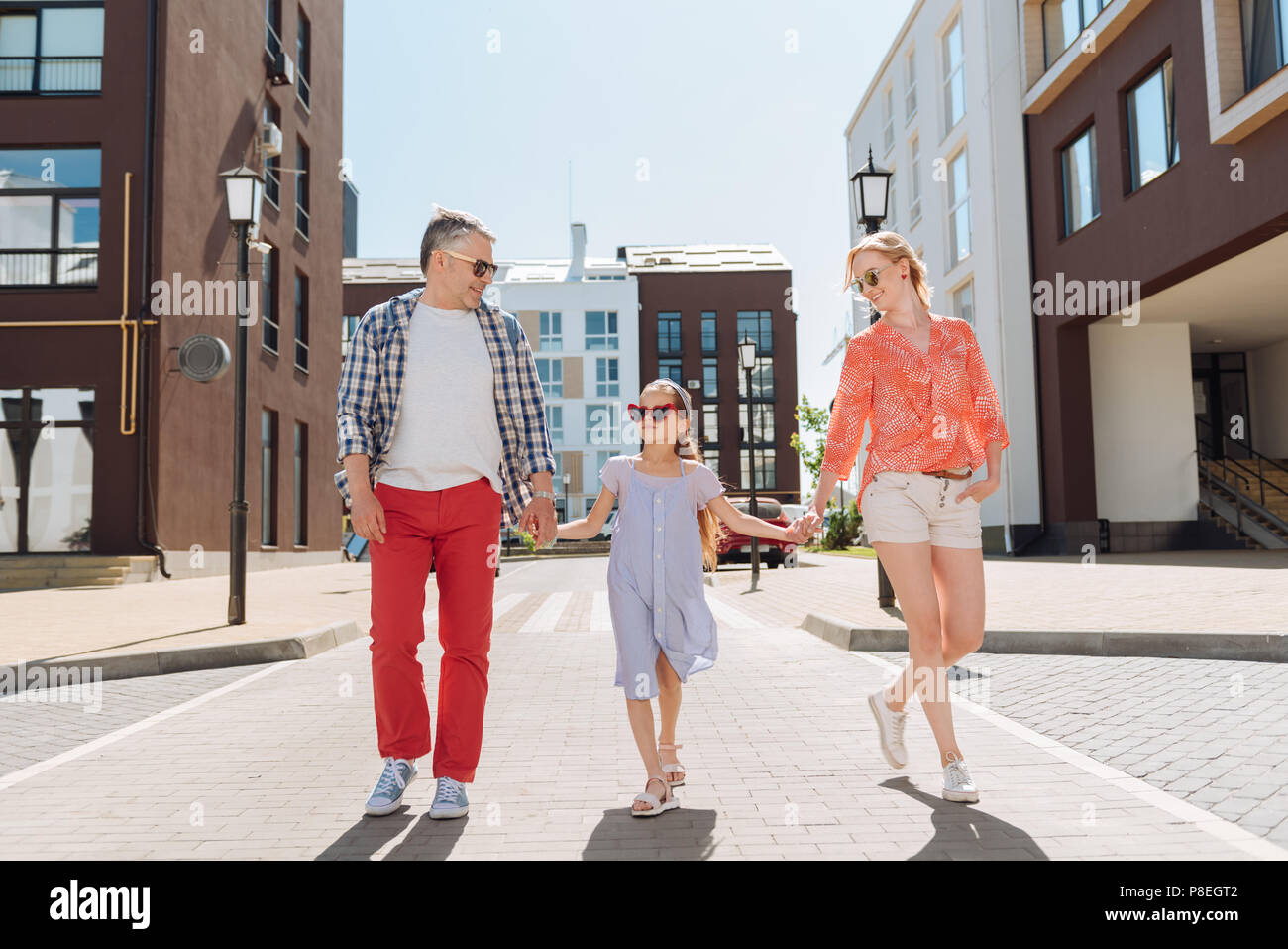 Delighted positive family having a walk Stock Photo - Alamy