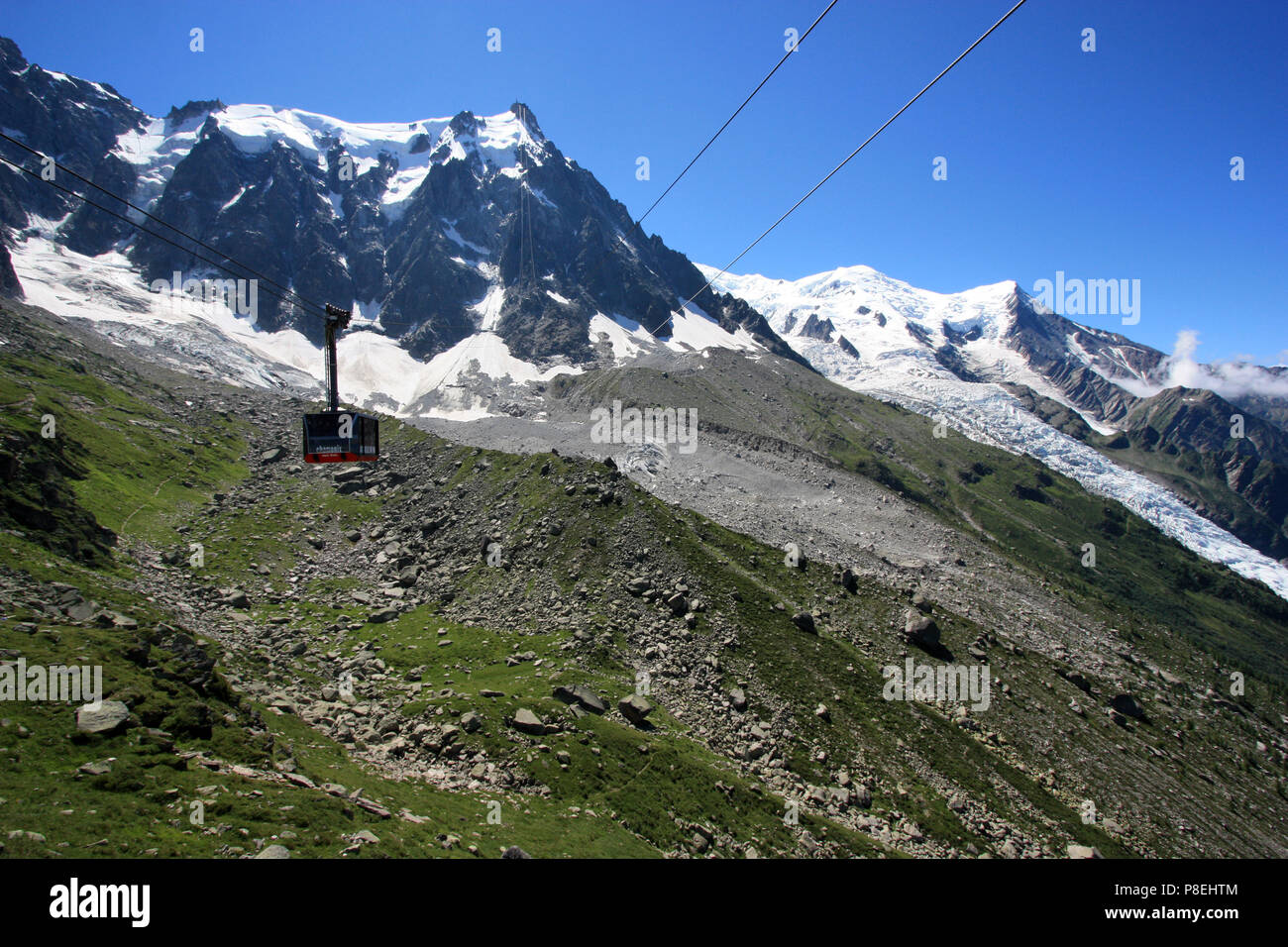 Cable car heading for the peak of the Aiguille-du-Midi in the Mont ...