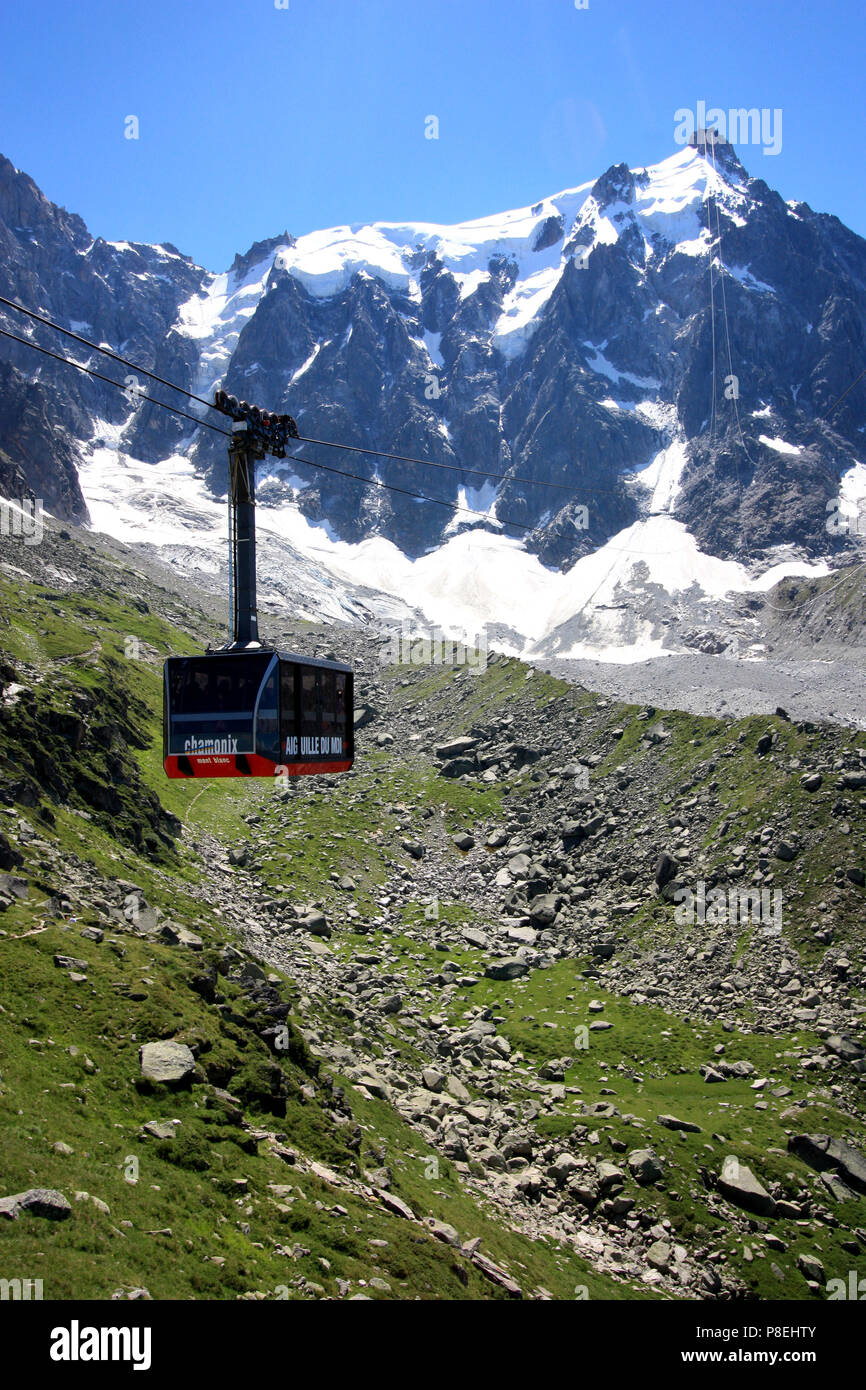 Cable car heading for the peak of the Aiguille-du-Midi in the Mont ...
